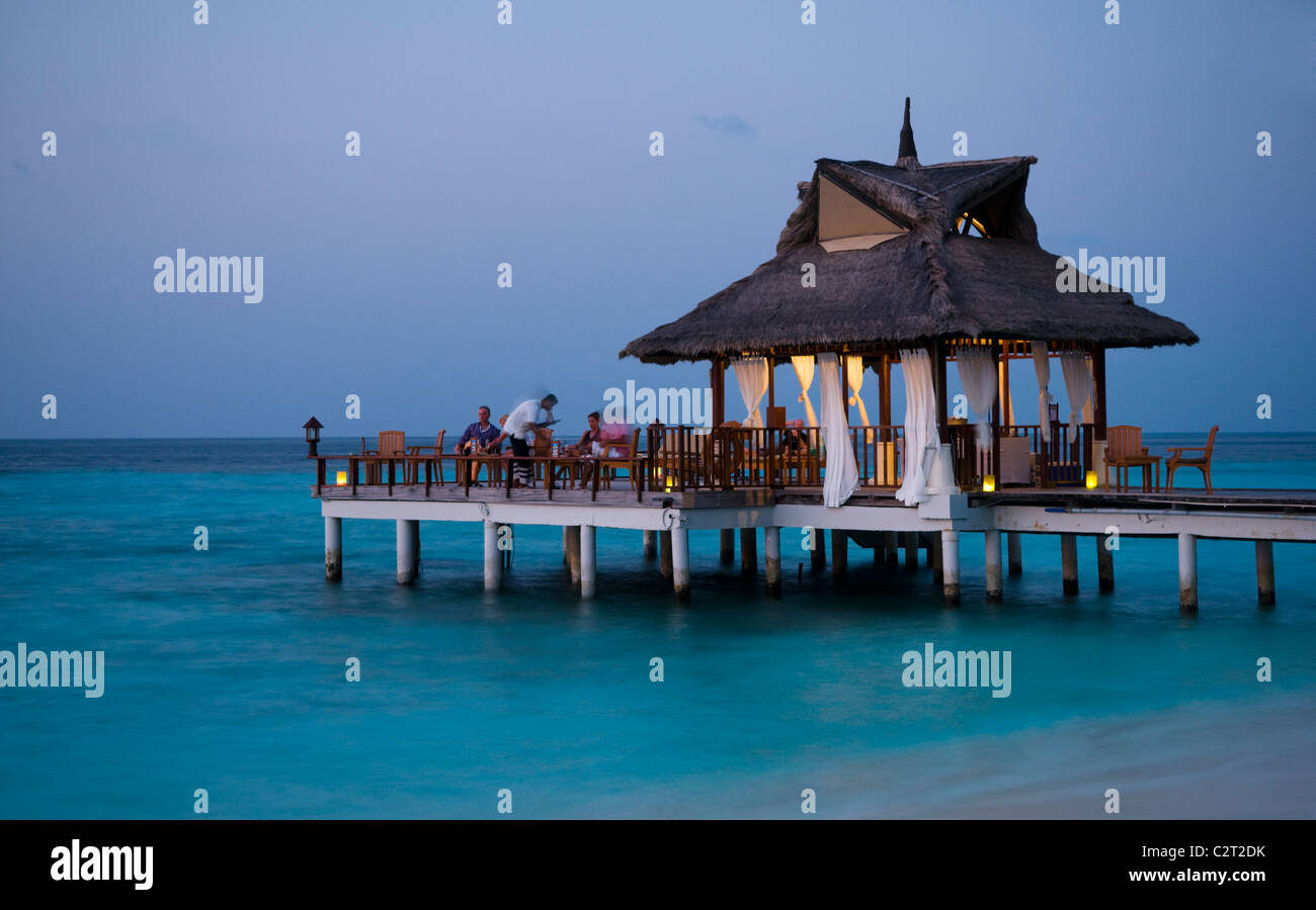 Gazebo and jetty with straw roof at a resort in the Maldives Stock ...