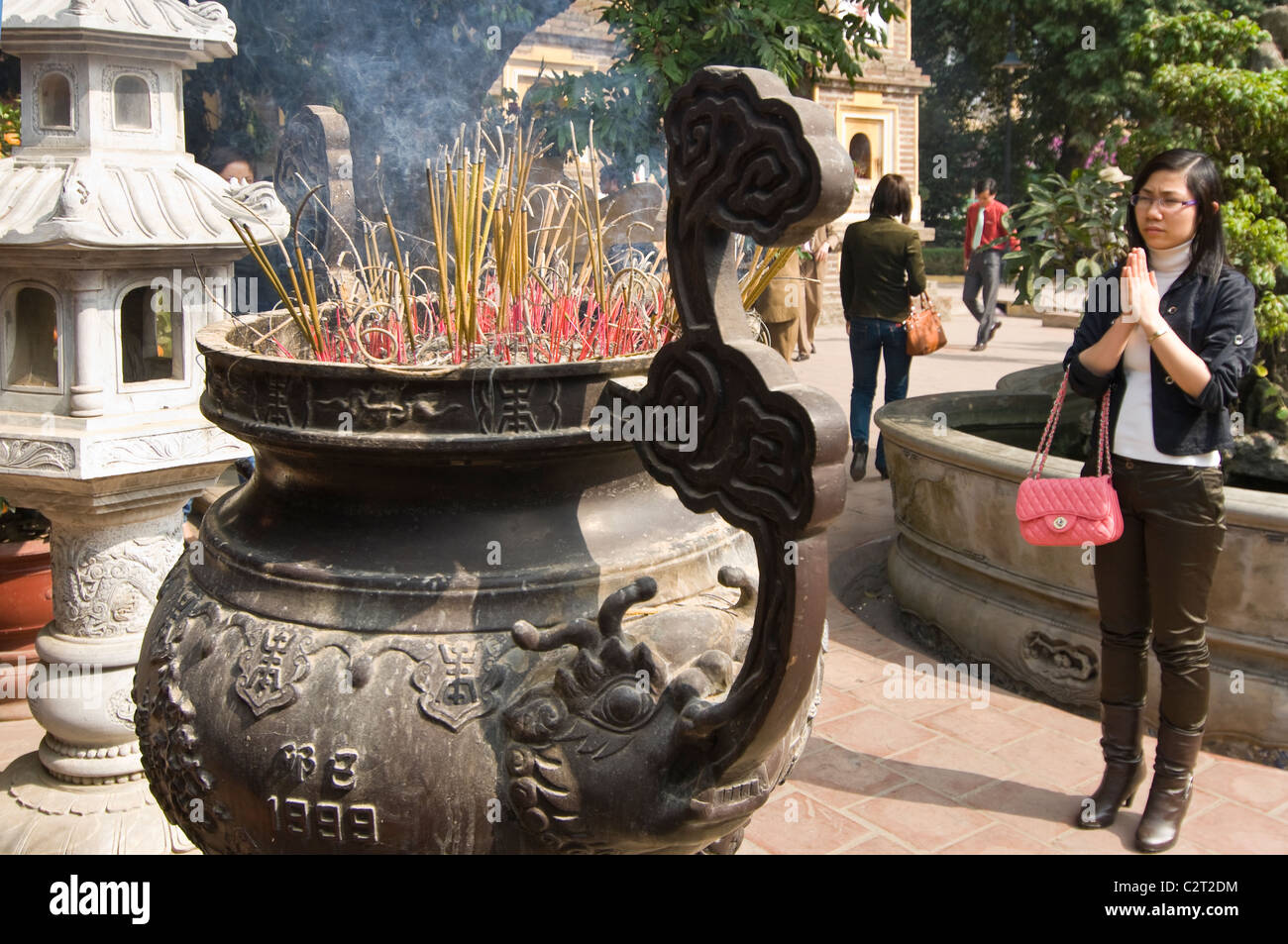 Horizontal close up of incense burning in a large censer at Tran Quoc ...