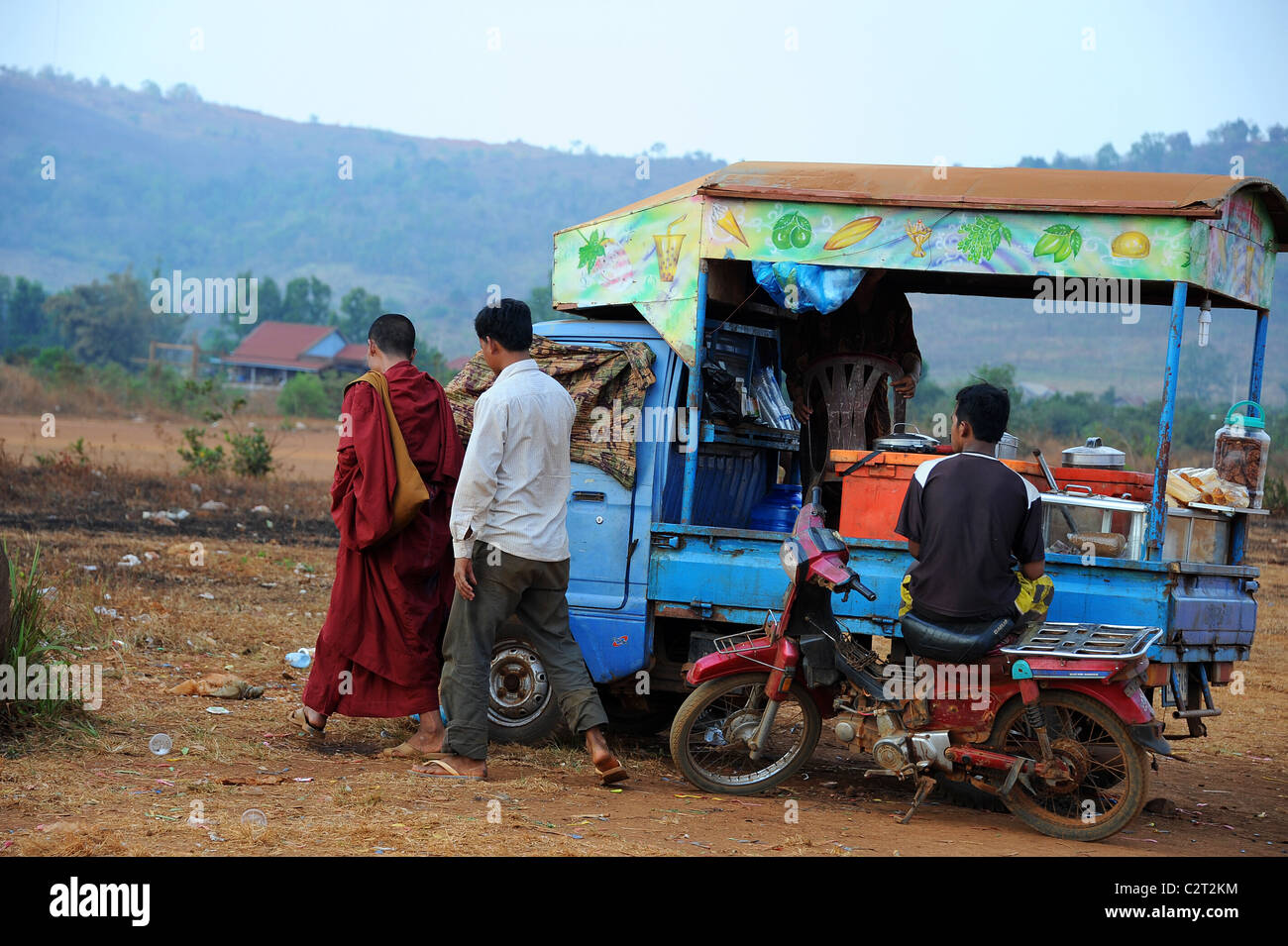 Buddhist monk and friend go for a snack at a mobile van Stock Photo - Alamy