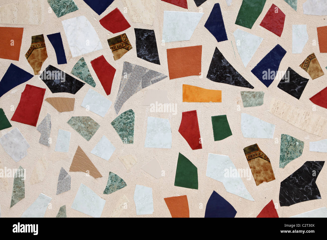 Colorful wall with broken fragments of tiles Stock Photo - Alamy