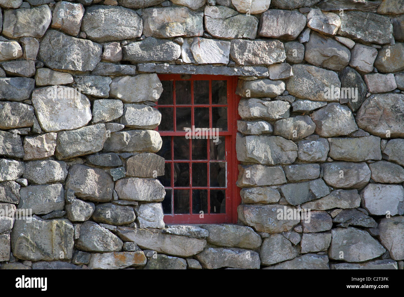 Red wooden window frame in stone wall of mill house Stock Photo - Alamy