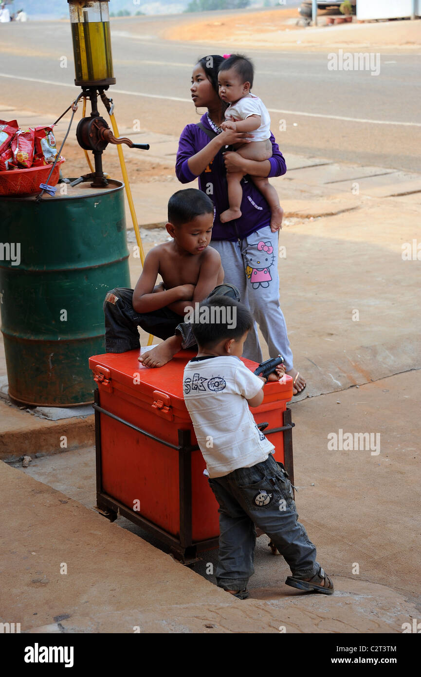 Two young boys playing on the pavement in Sen Monorom town. Cambodia ...