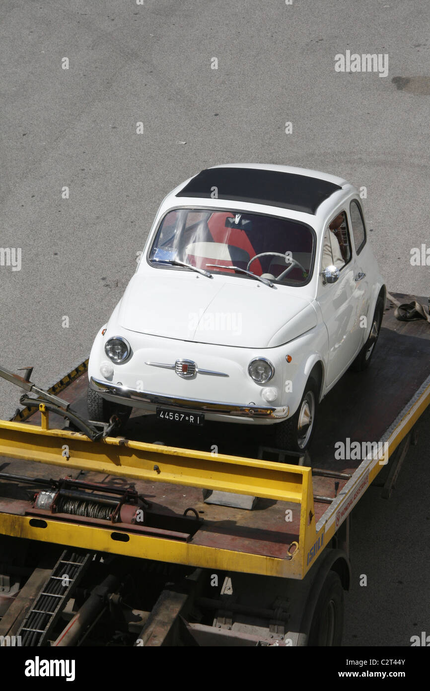 old fiat 500 on back transport truck lorry in italy Stock Photo - Alamy