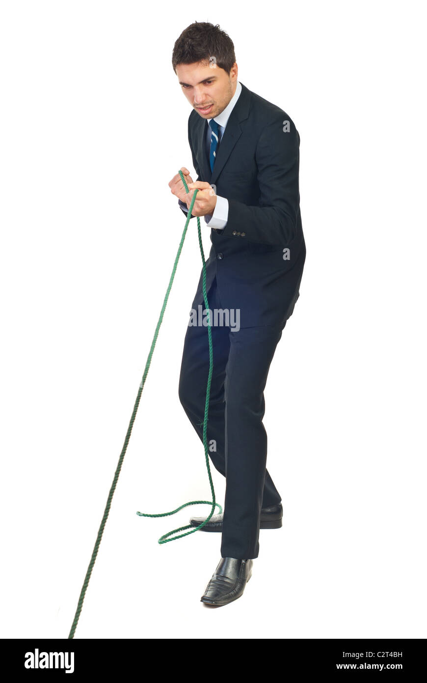 Full length of business man trying hard to pulling rope isolated on ...