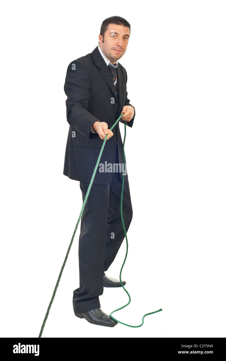 Mid adult business man pulling rope isolated on white background Stock ...