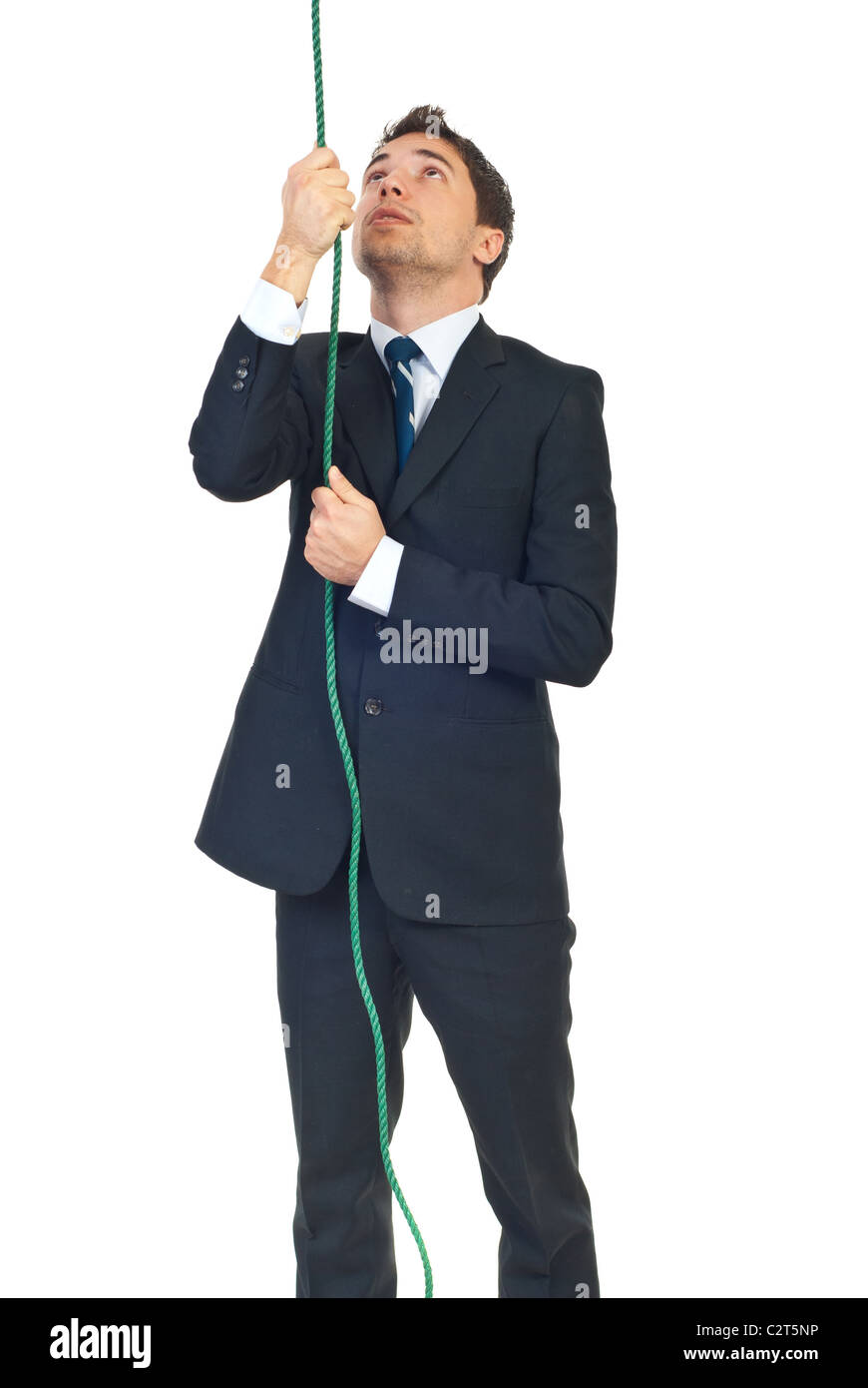 Young business man trying to climbing rope and looking up isolated on ...