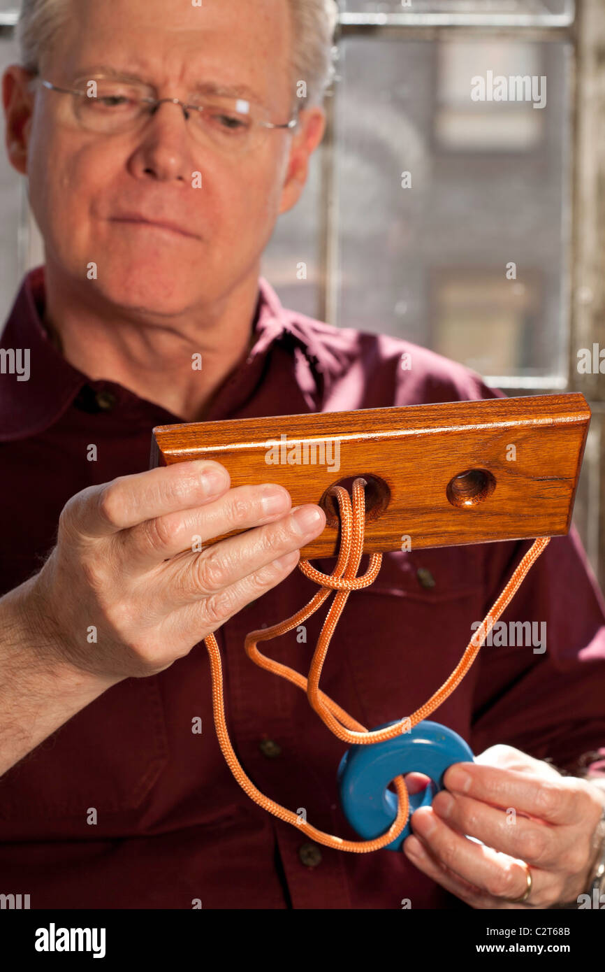 Mature Man Solving Logic Puzzle Stock Photo - Alamy