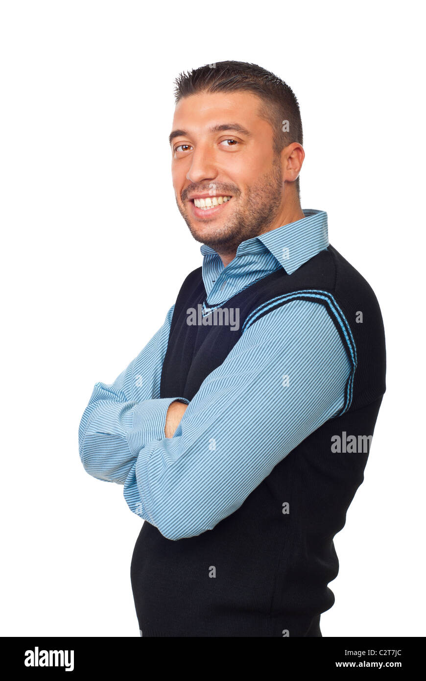 Smiling executive man standing with arms folded in semi profile ...