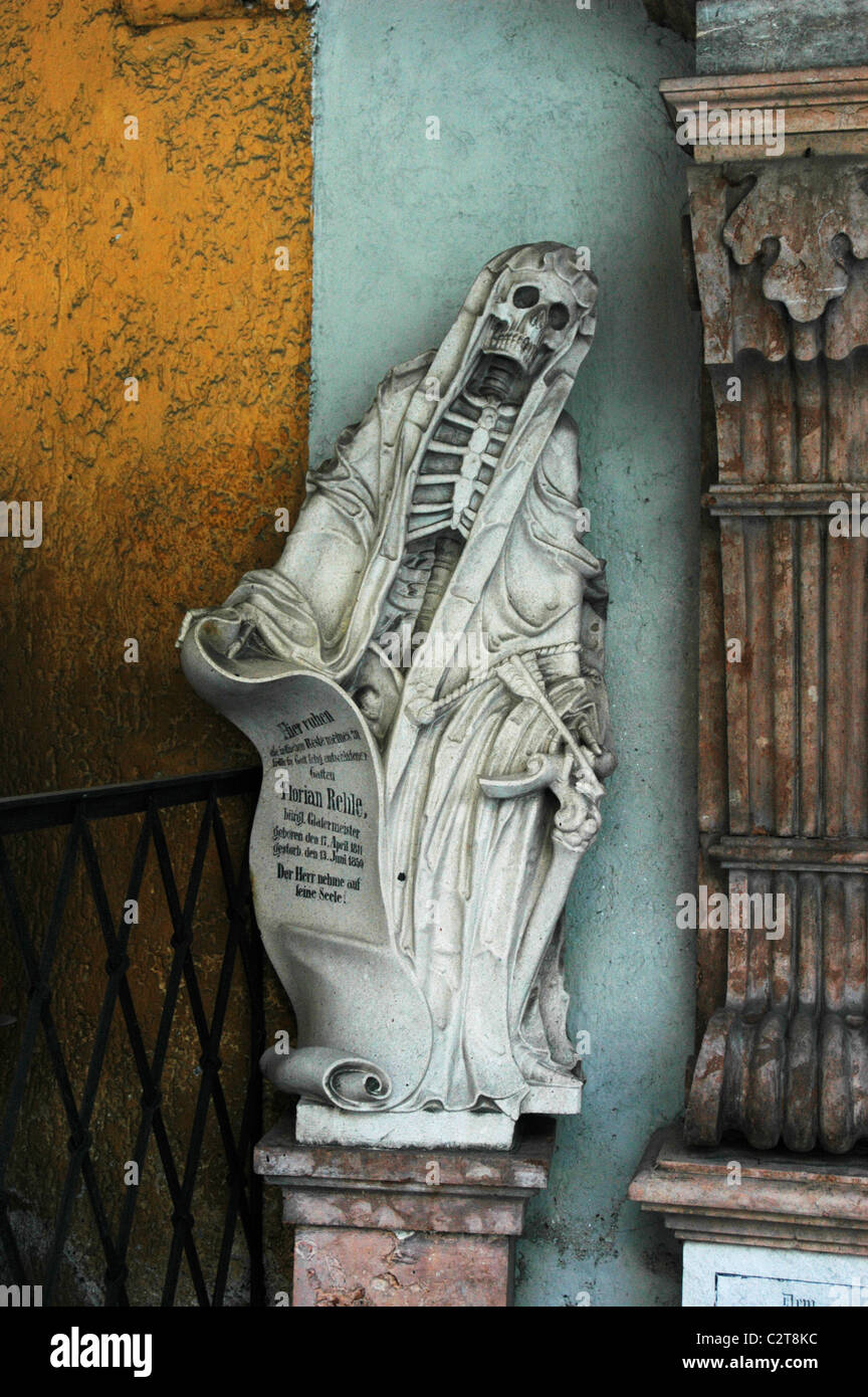 Skeleton statue on tombstone in Salzburg cemetery Stock Photo - Alamy