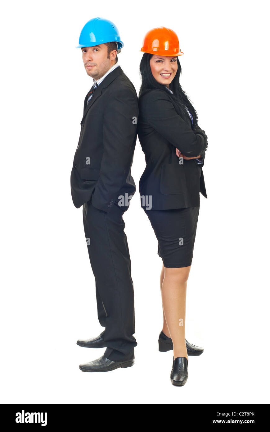 Full length of two attractive engineers man and woman standing back to ...