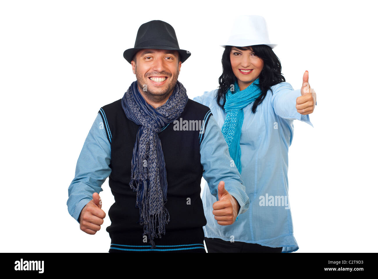 Cool happy couple giving thumbs up and smiling isolated on white ...