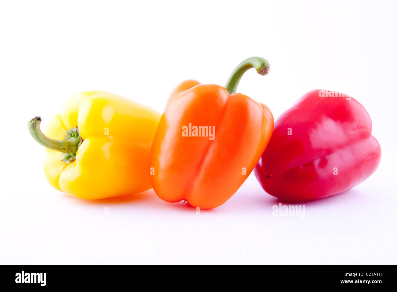three bell peppers isolated on white background Stock Photo - Alamy
