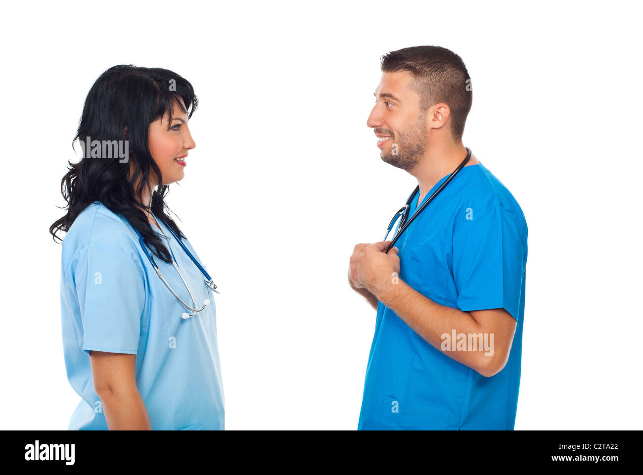 Two doctors standing face to face and having an conversation isolated ...