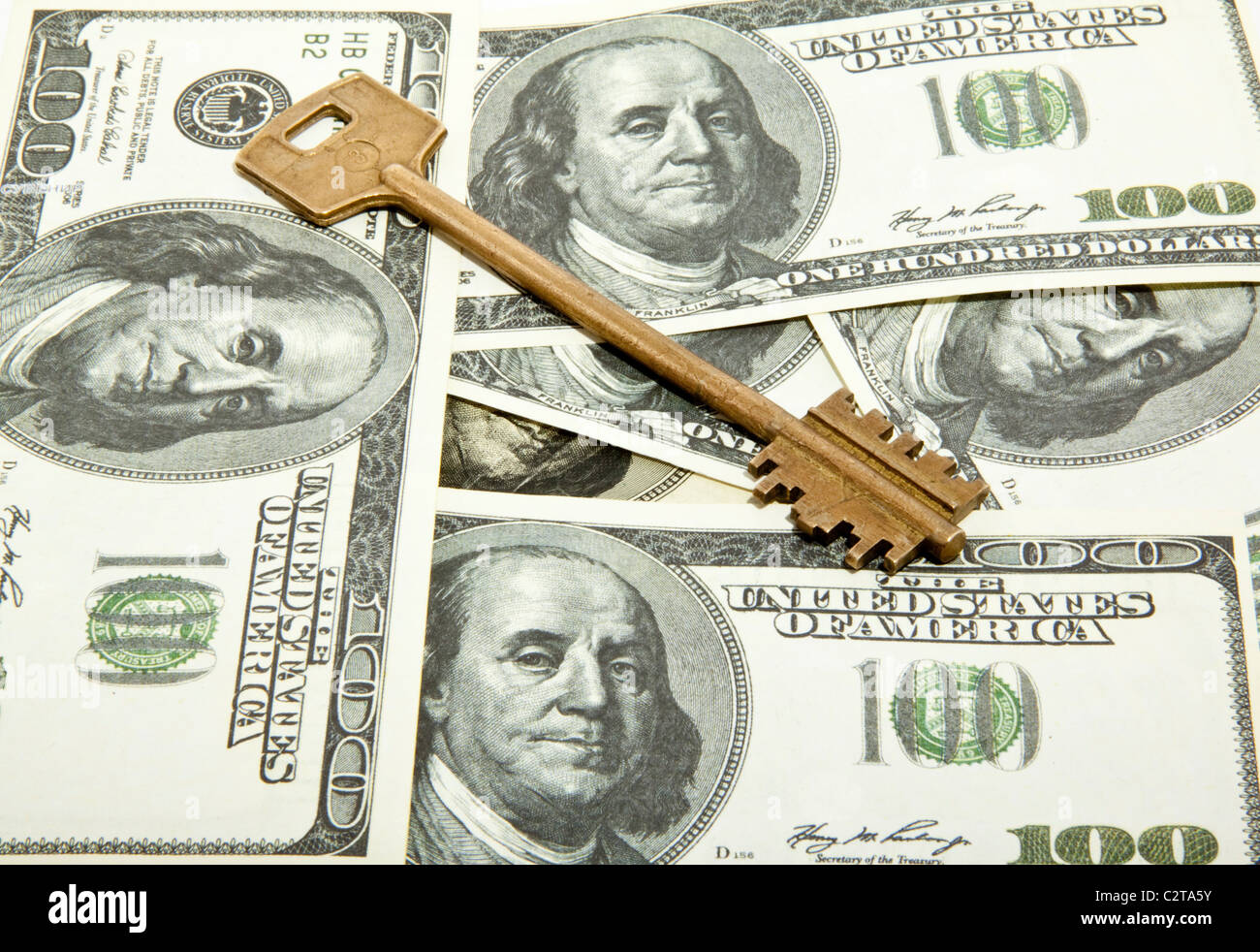 key on dollars background or texture for you site Stock Photo - Alamy