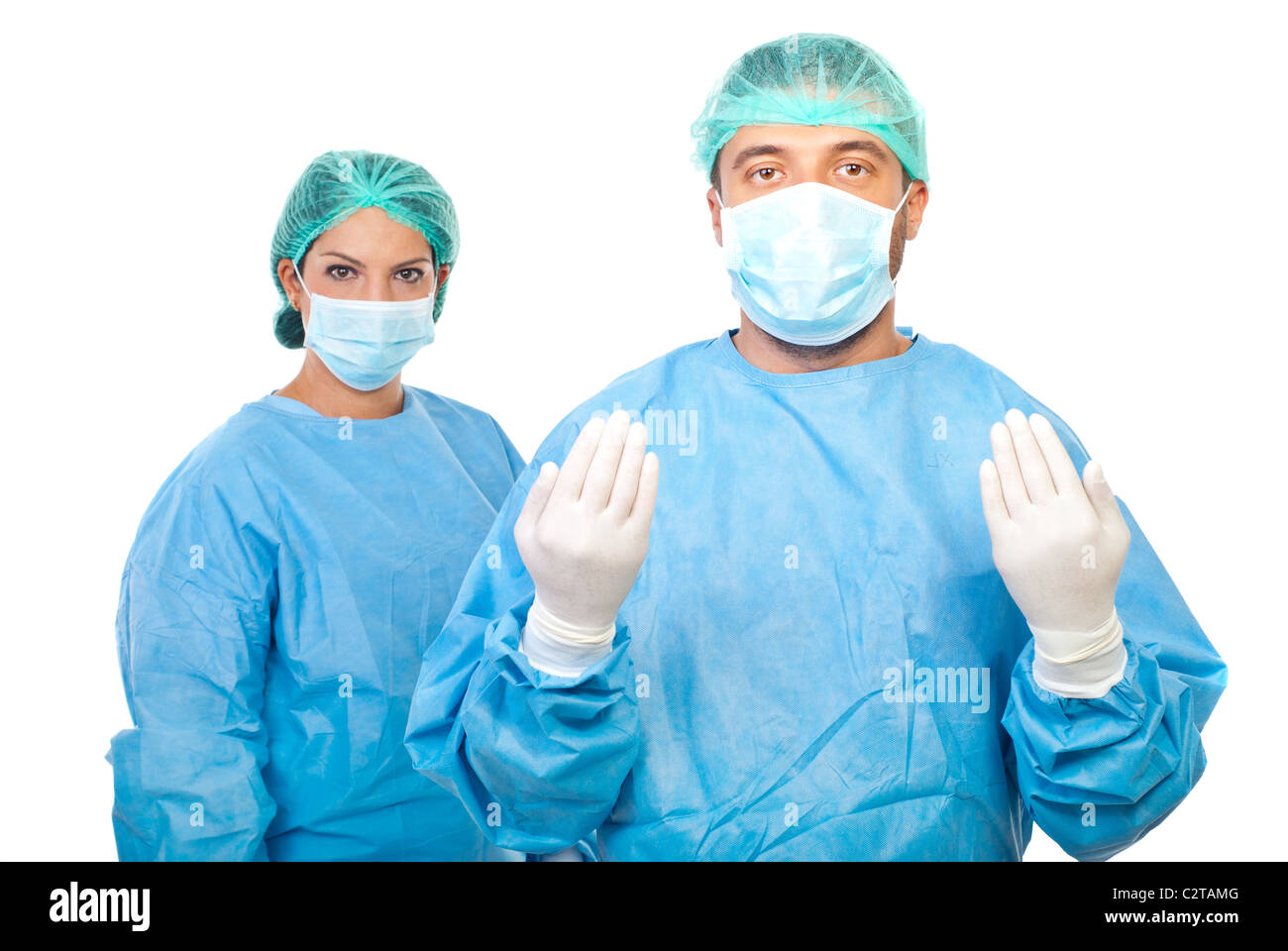 Two surgeons team preparing for surgery isolated on white background ...