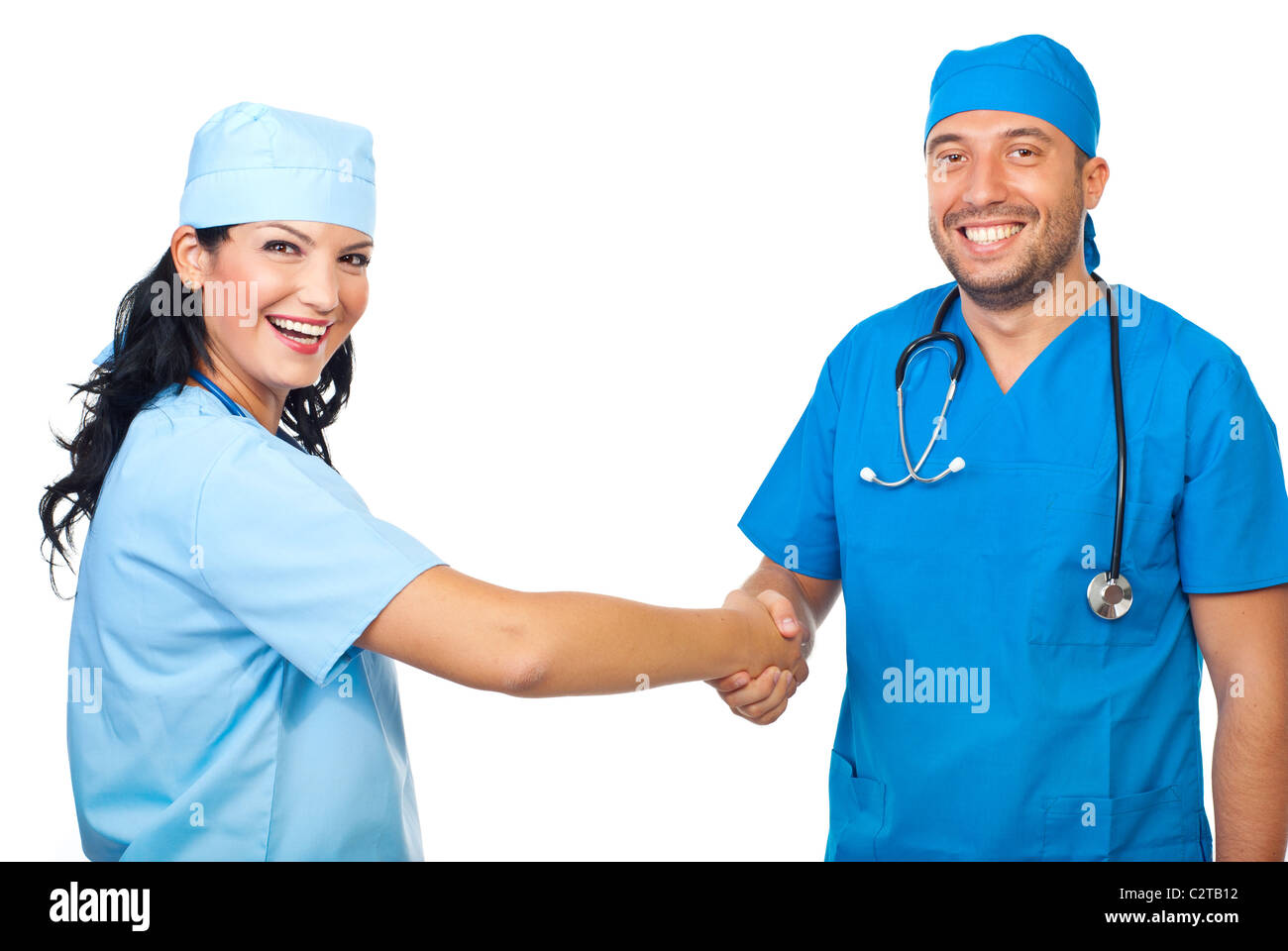 Two laughing doctors shaking their hands and congratulate each other ...