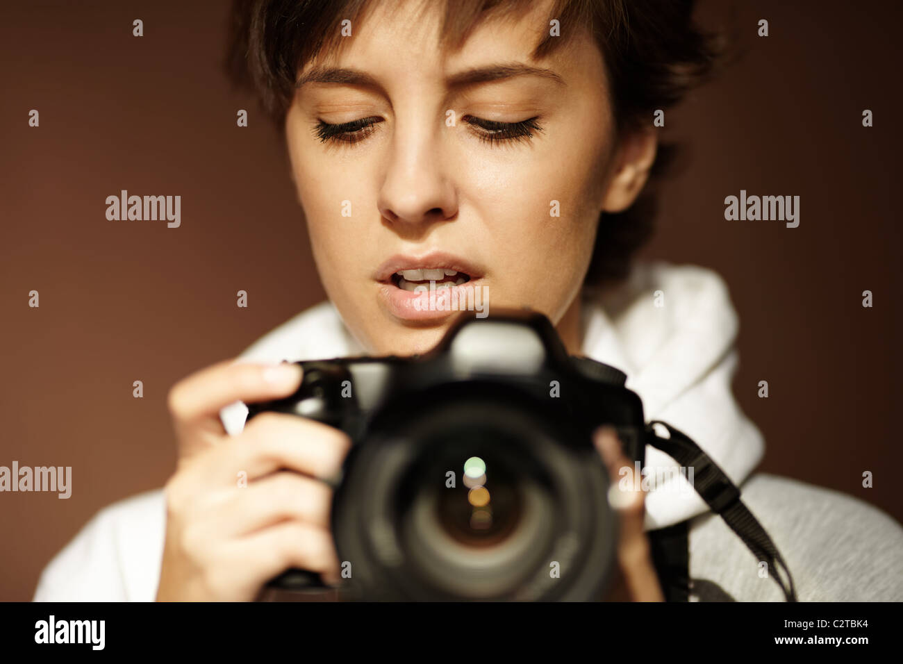 young woman with black slr camera Stock Photo - Alamy