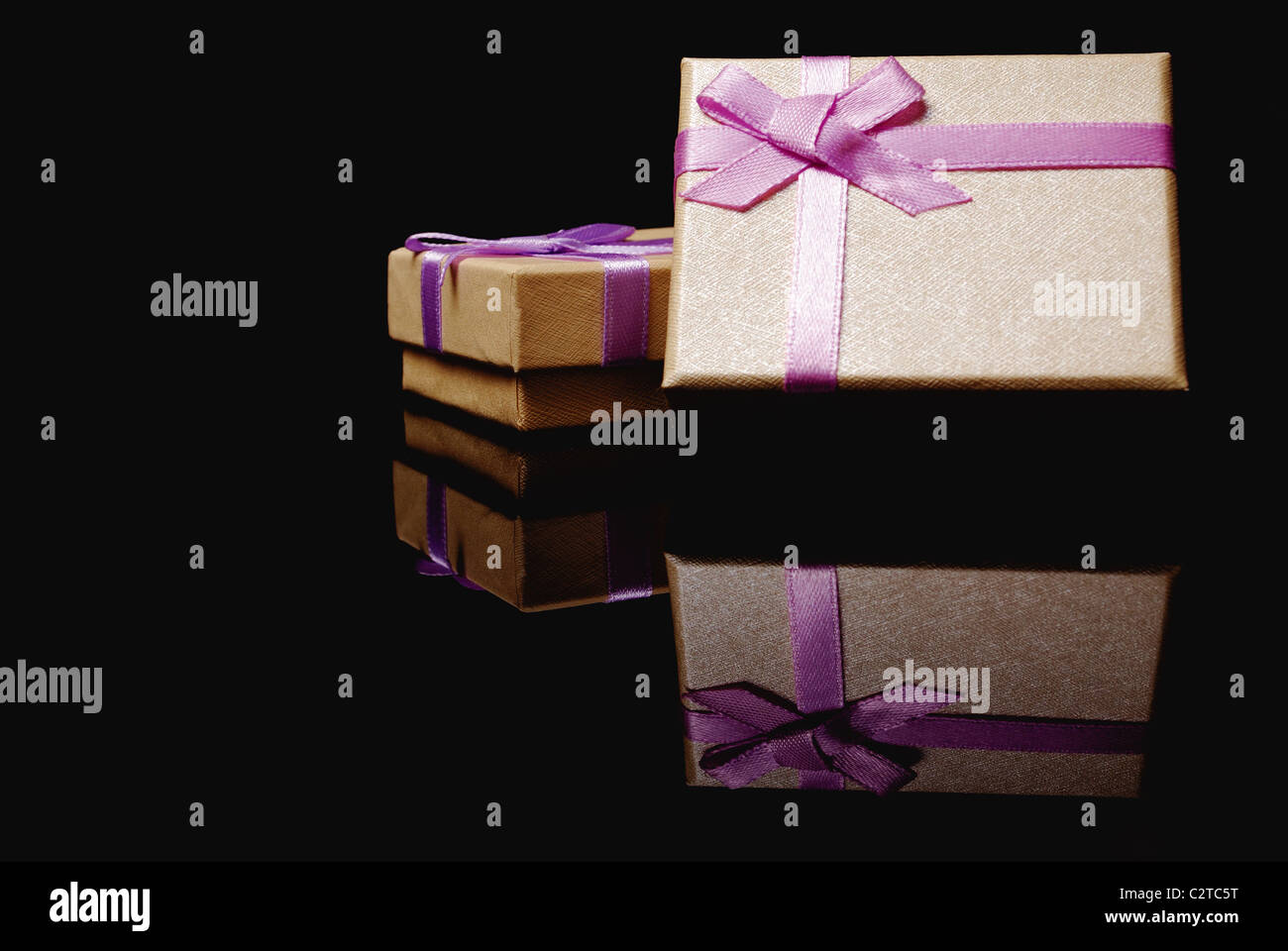 two gift boxes on black Stock Photo - Alamy
