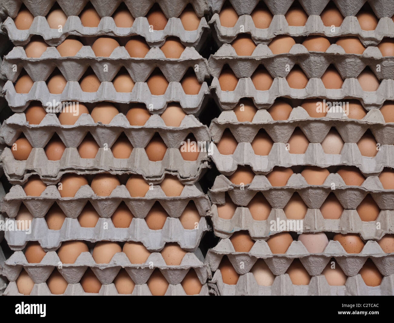 Eggs in pressed paper holders are stacked up for sale in the public ...