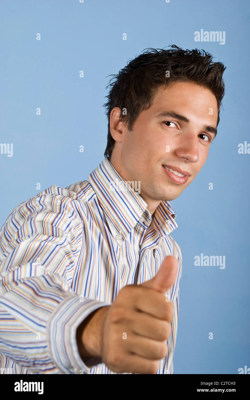 Cool young business man with modern hairstyle giving thumbs up isolated ...