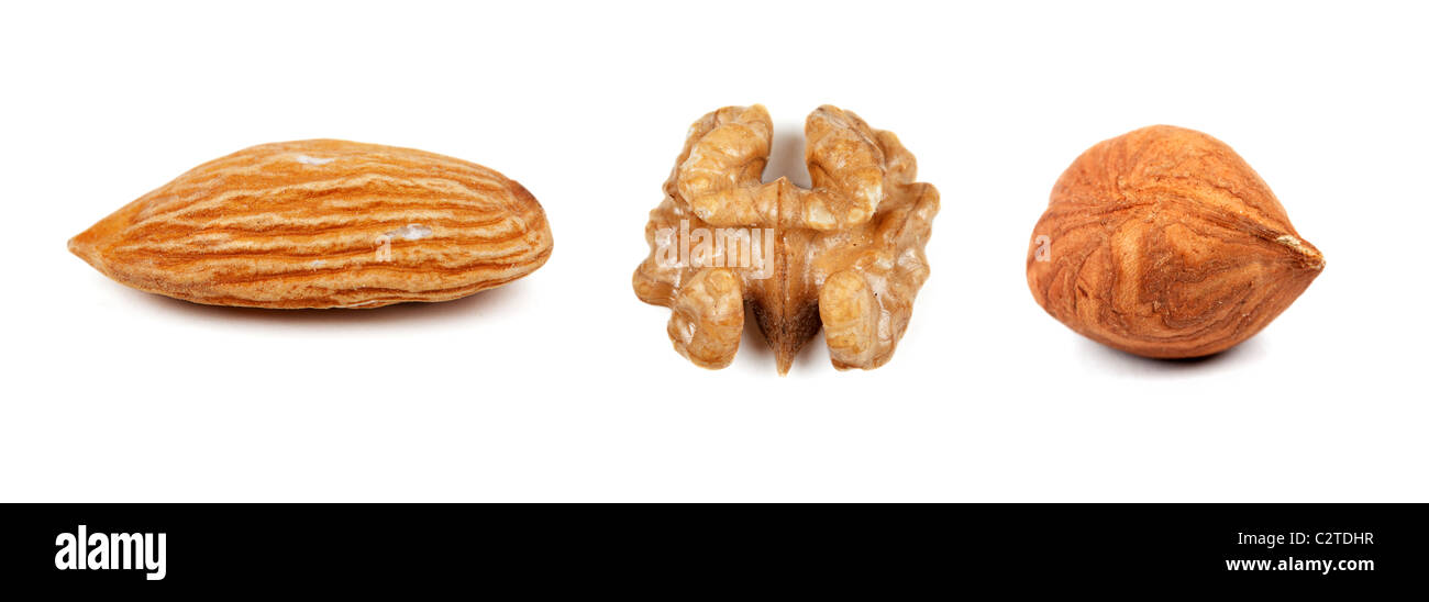 Collage of the three nuts, walnuts, hazelnuts, almonds, isolated on a ...