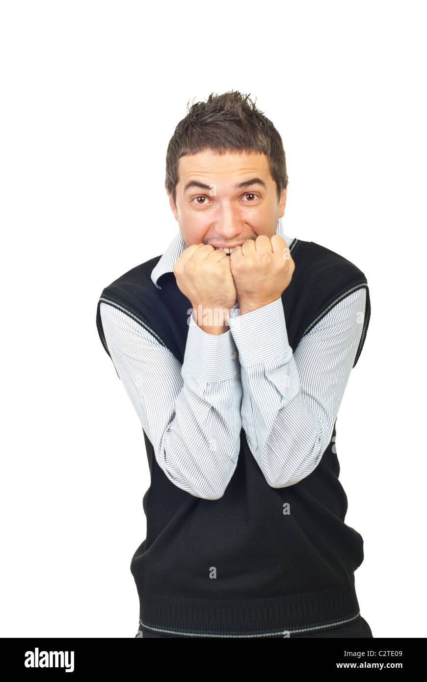 Desperate young man screaming and holding his hands to mouth isolated ...