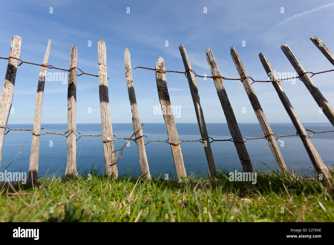 An old falling down fence protecting a cliff side path on the ...