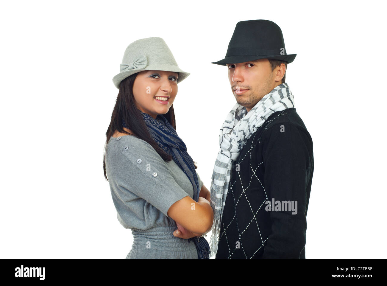 Modern young couple wearing hats isolated on white background Stock ...