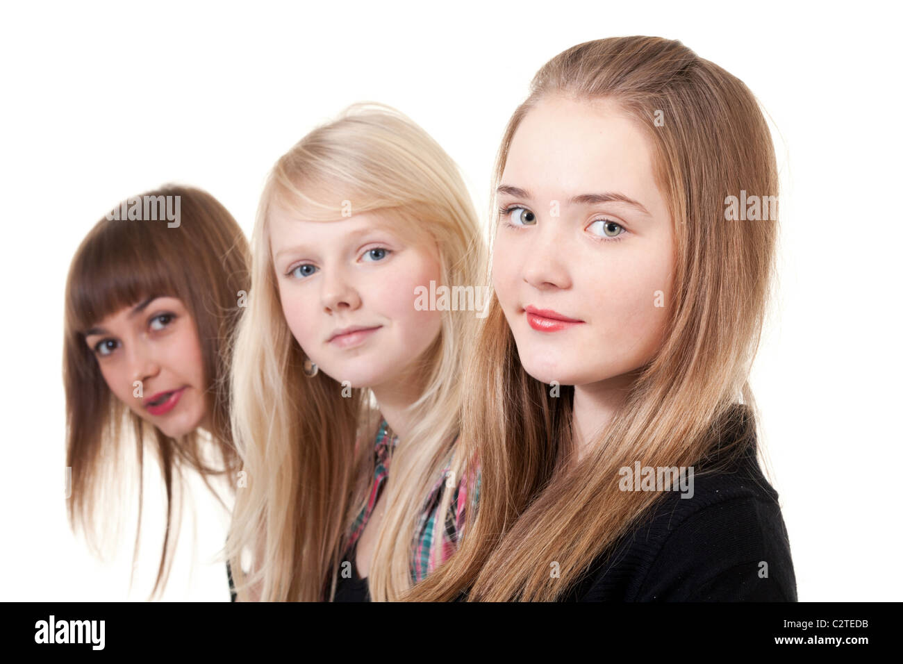 portrait of three girls isolated on white background Stock Photo - Alamy