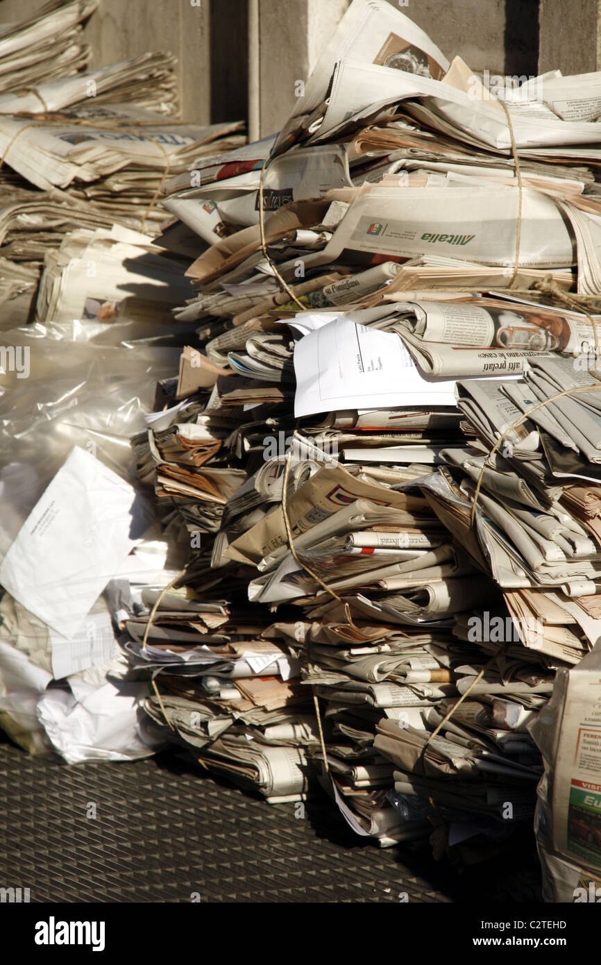 pile of old used newspapers left in street road in city town Stock ...
