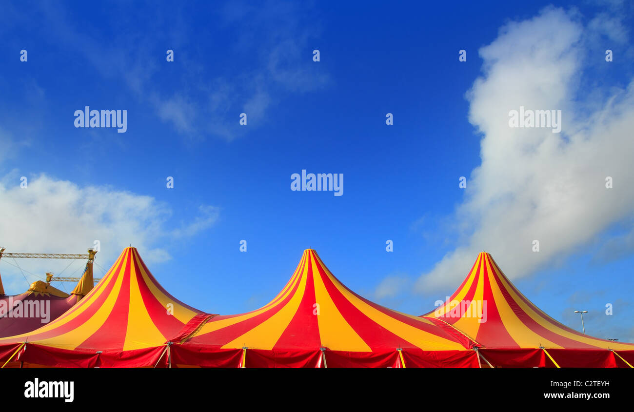 Circus tent red orange and yellow stripped pattern blue sky Stock Photo ...