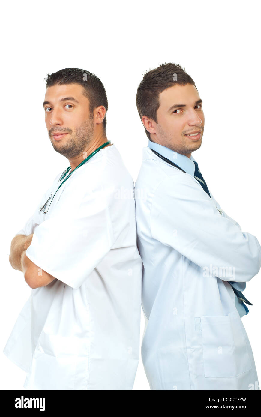 Two friendly smiling doctors men standing back to back with arms folded ...