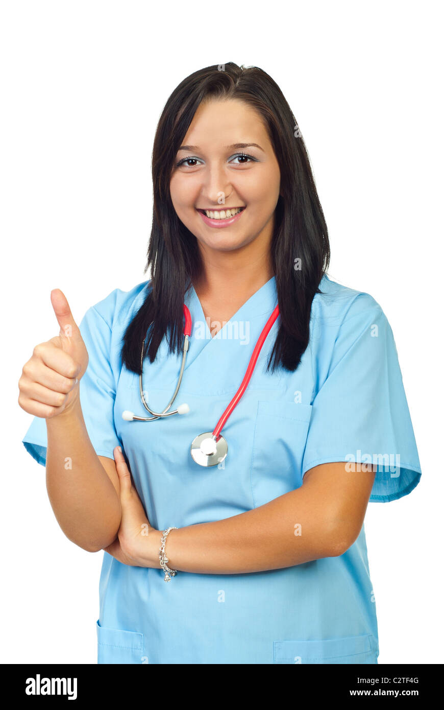 Young smiling physician woman giving thumbs up isolated on white ...