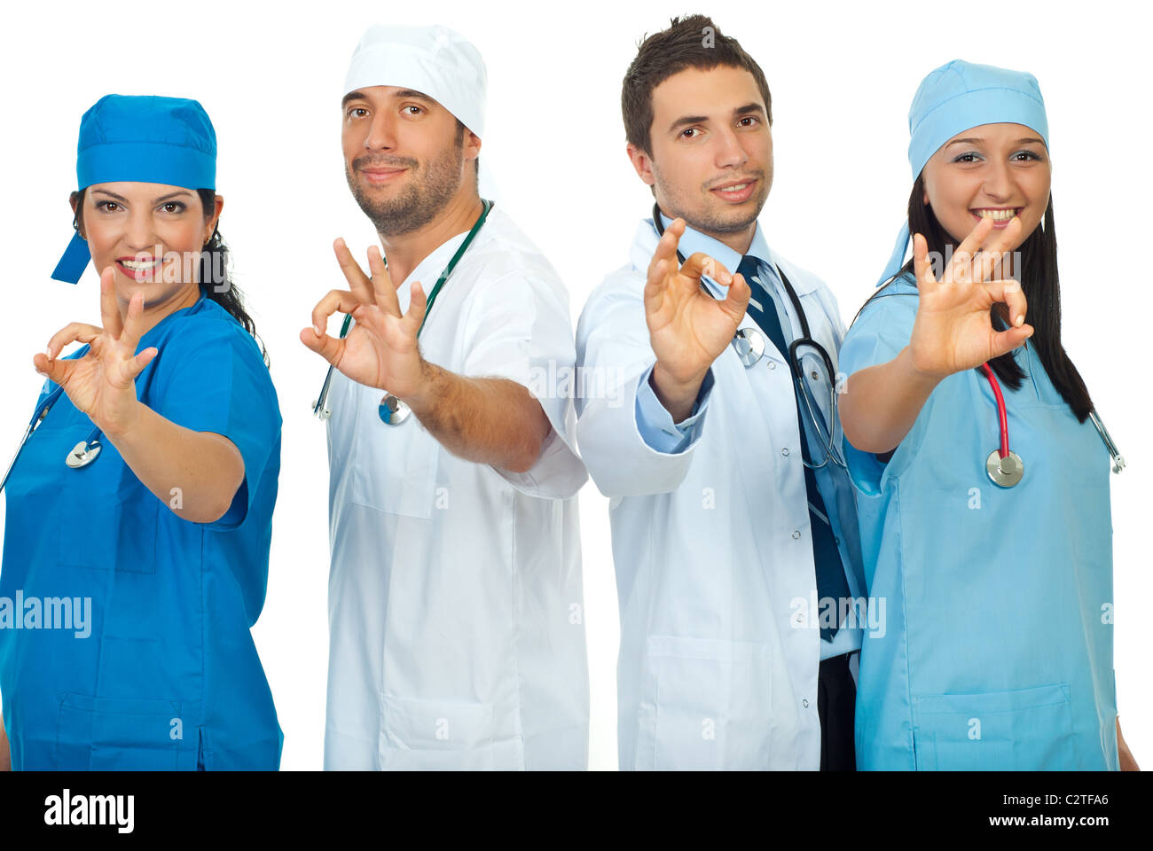 Successful team of doctors showing okay sign hand and standing in a row ...