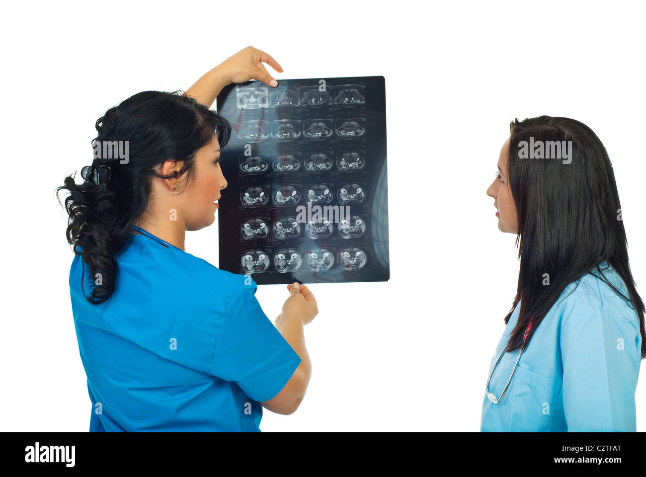 Two radiologists woman holding a magnetic resonance imaging and ...