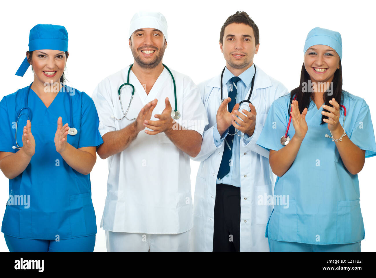 Successful team of four different doctors applauding together isolated ...