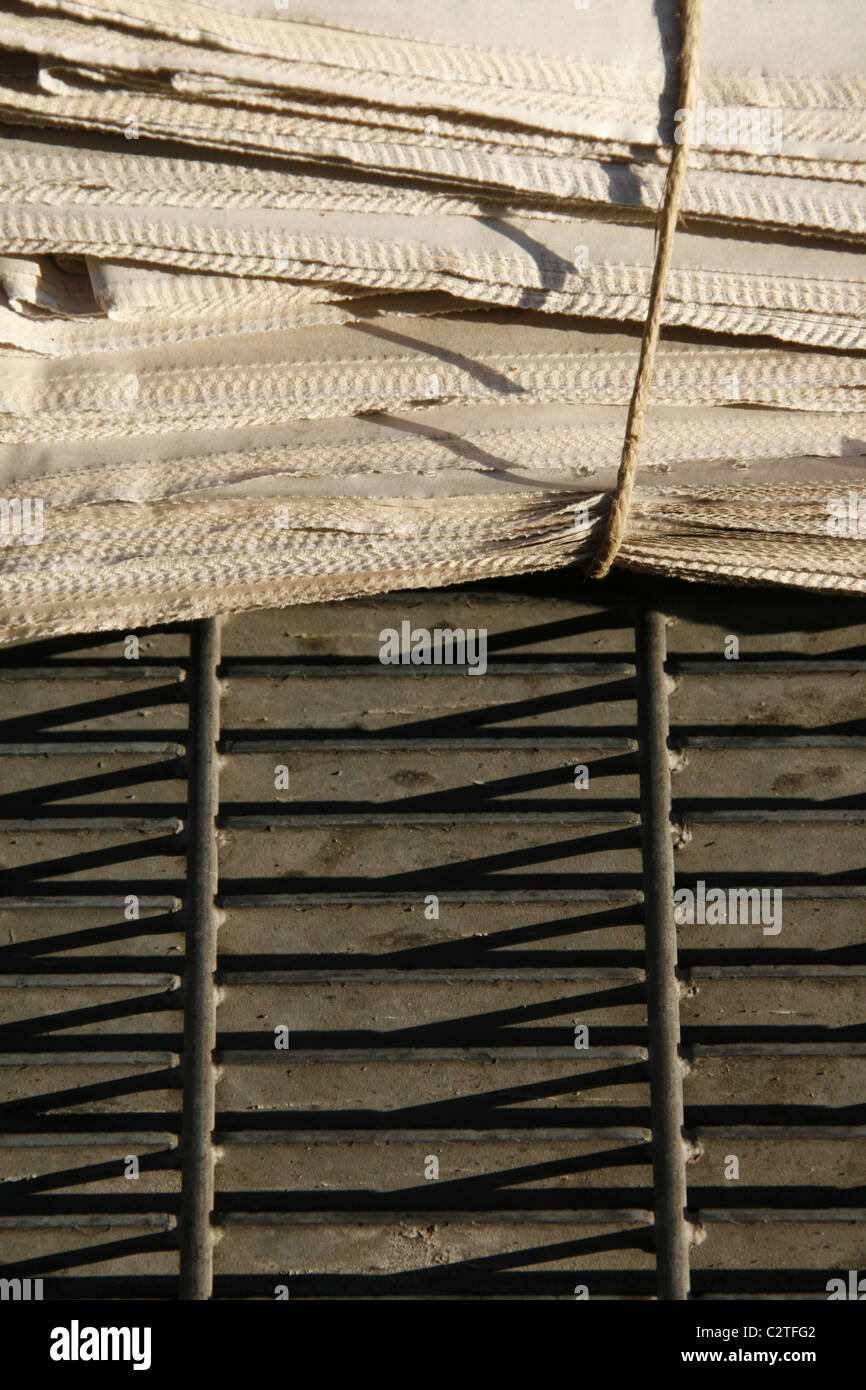 pile of old used newspapers left in street road in city town Stock ...