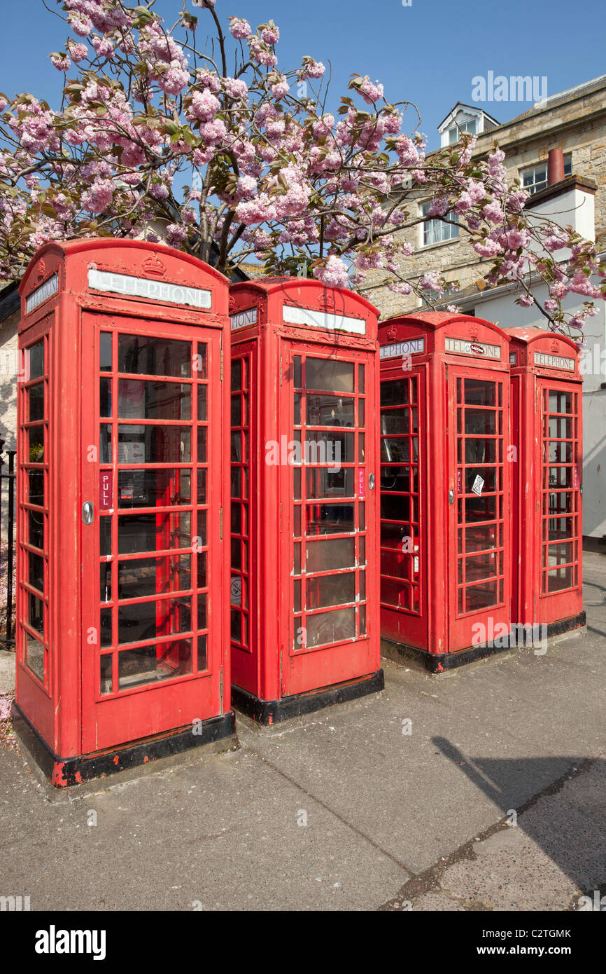 Row of 4 red British phone boxes in Truro, Cornwall UK Stock Photo - Alamy