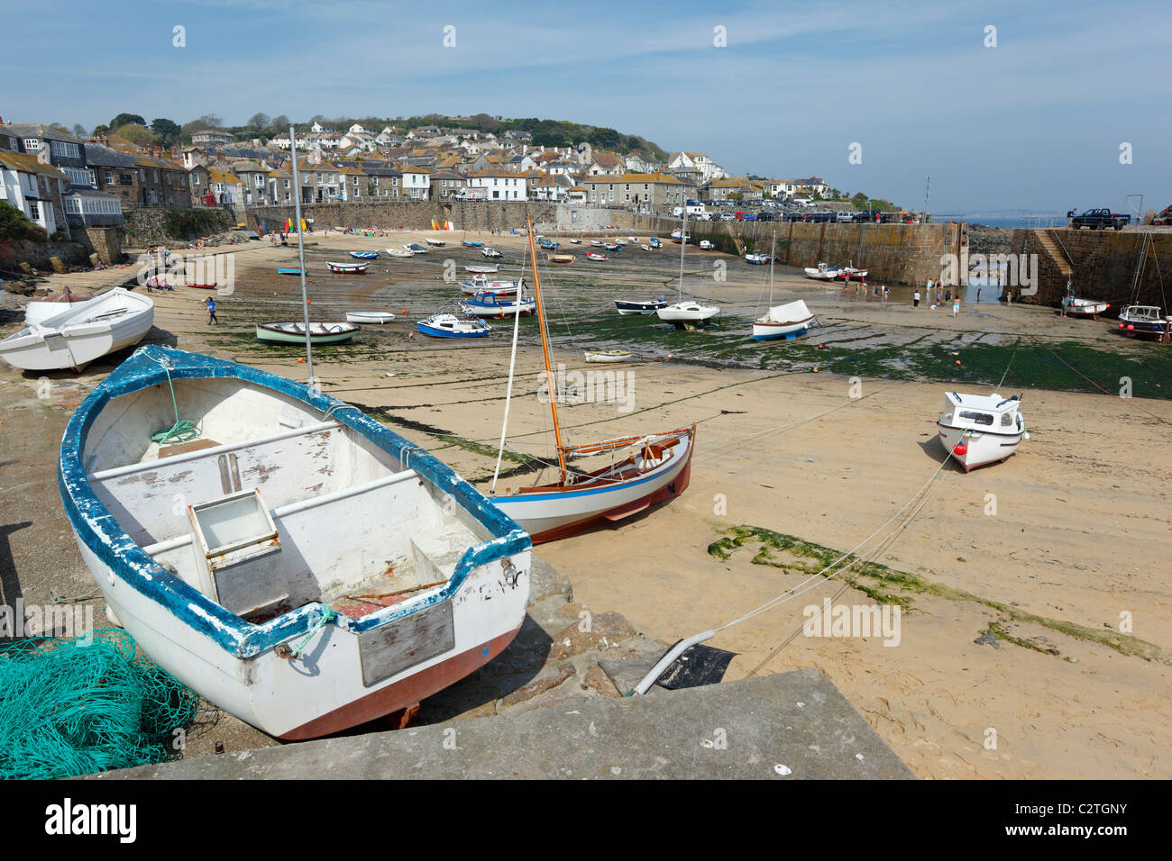 Mousehole harbour on a low spring tide, Cornwall UK Stock Photo - Alamy