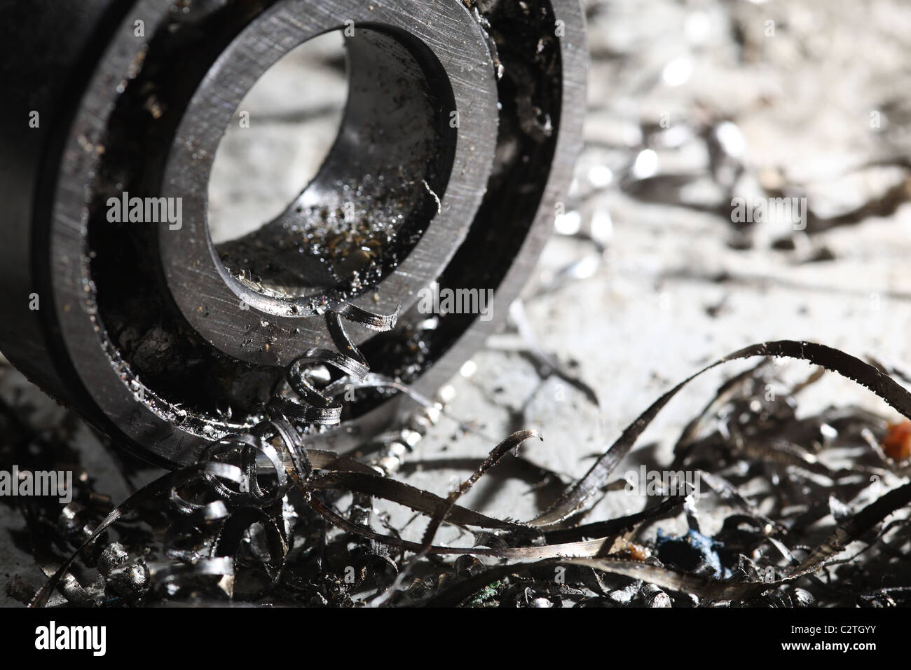 Damaged bearing surrounded by metal swarf Stock Photo - Alamy
