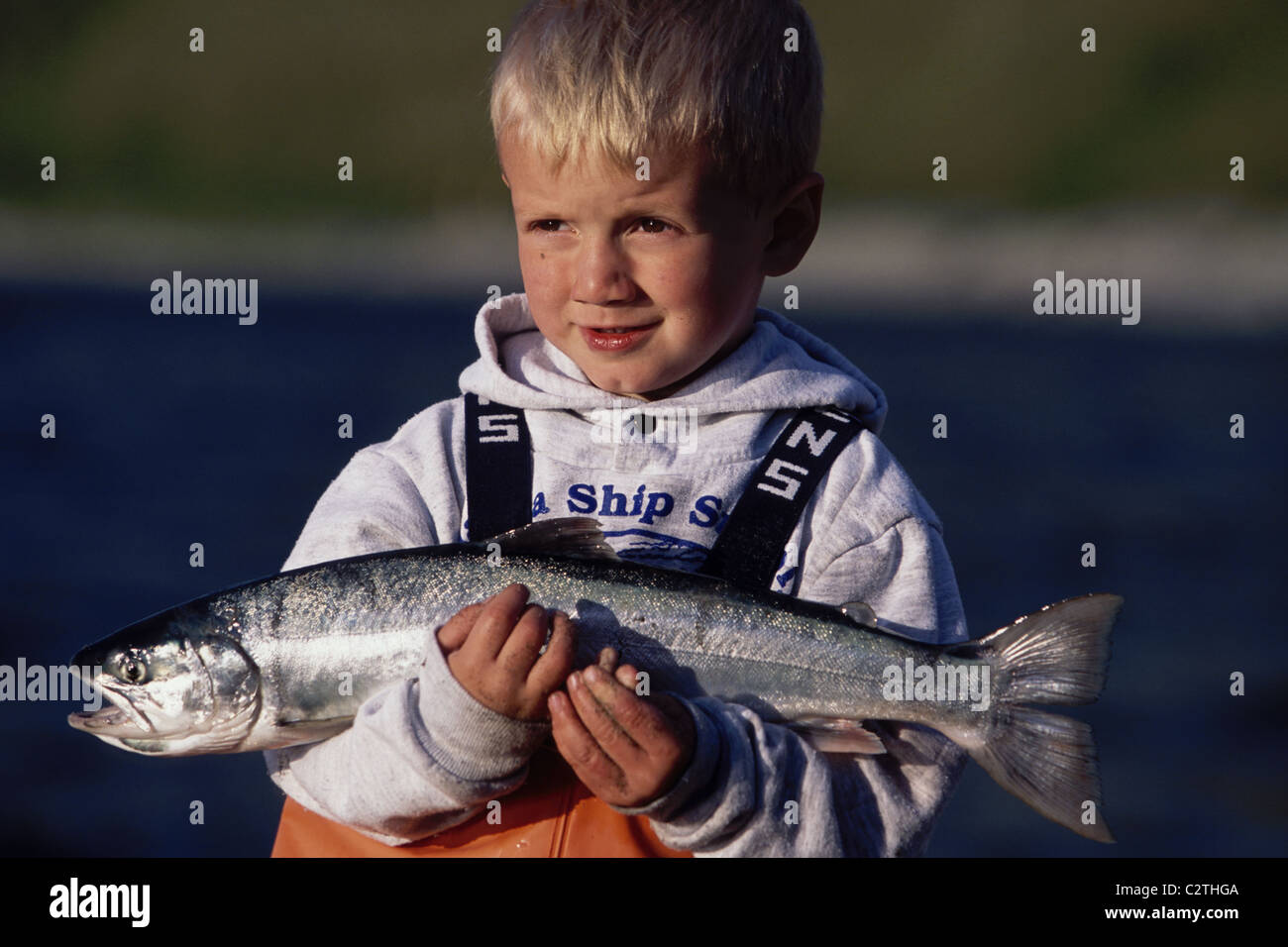 Boy Holding Red Salmon Unalaska AK Stock Photo - Alamy