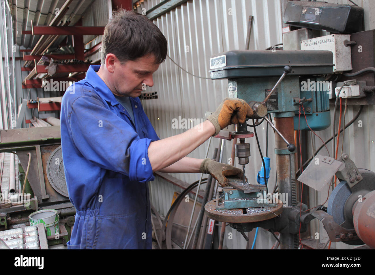 Engineer using a drill Stock Photo - Alamy