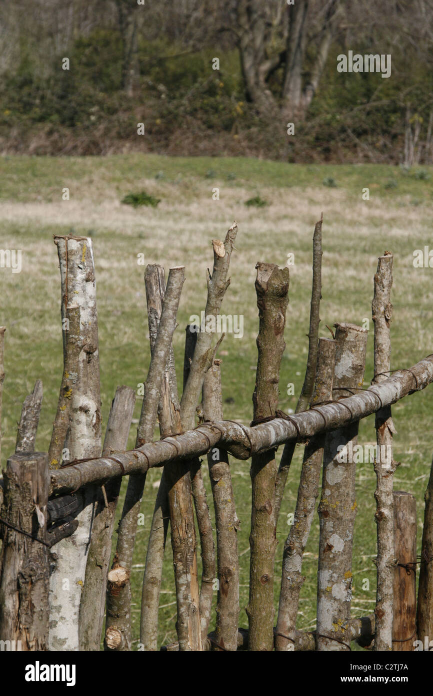 old style fence made with wooden branches sticks Stock Photo - Alamy