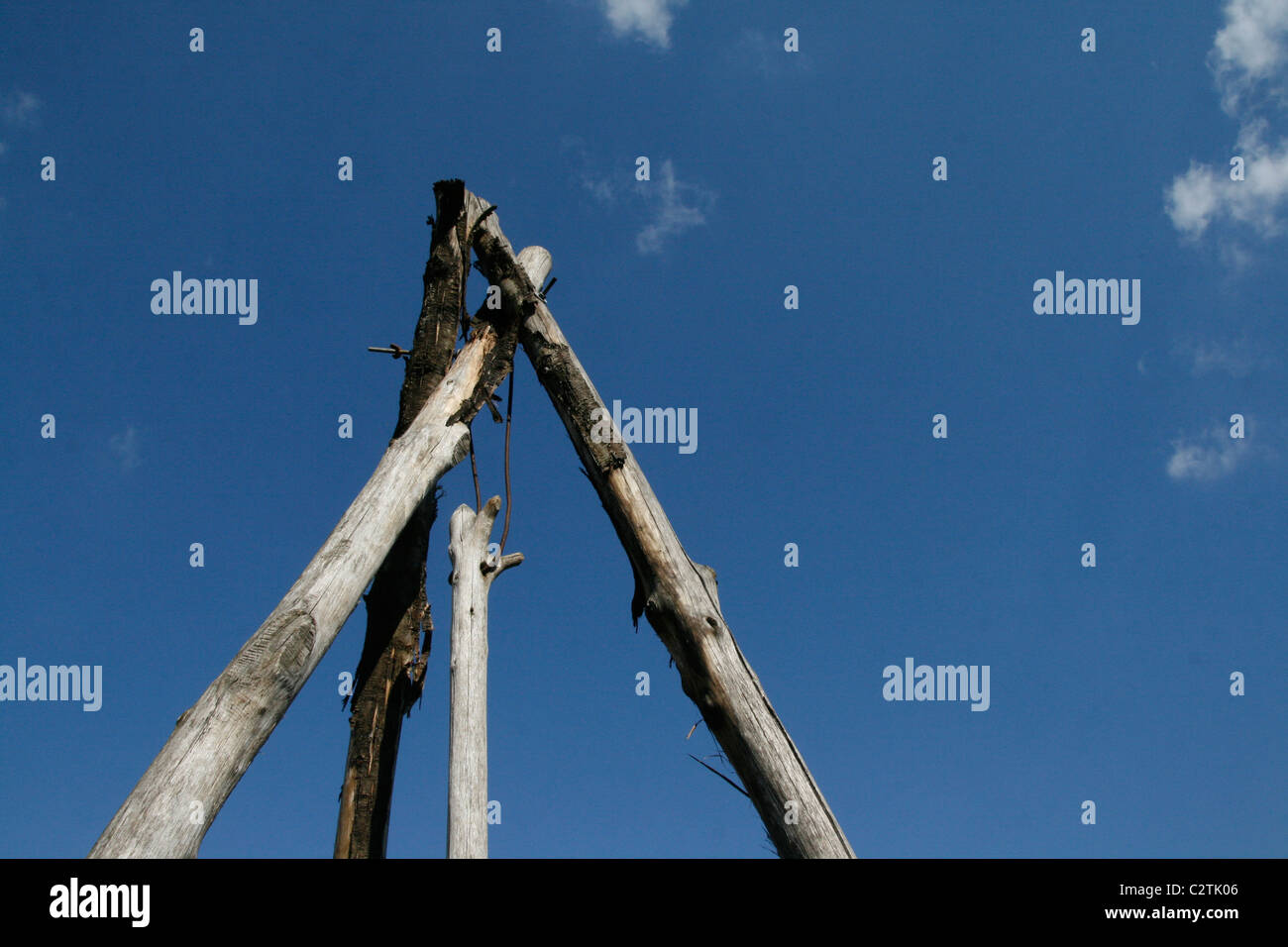 wooden tripod implement used for cooking over a fire Stock Photo - Alamy