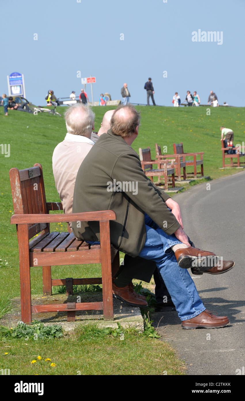 Men on park bench Stock Photo - Alamy