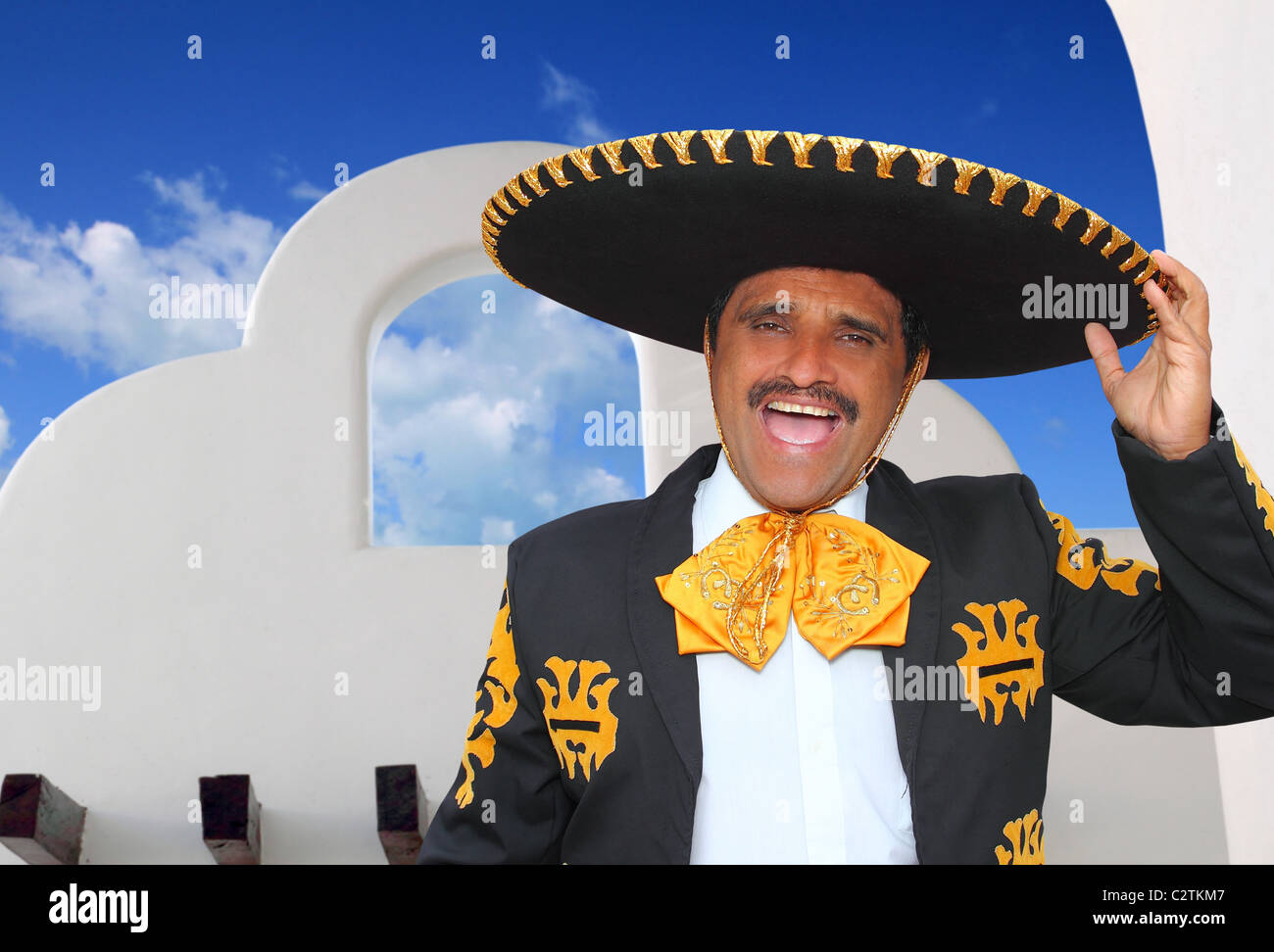 Charro mariachi portrait singing shout in mexican houses background ...