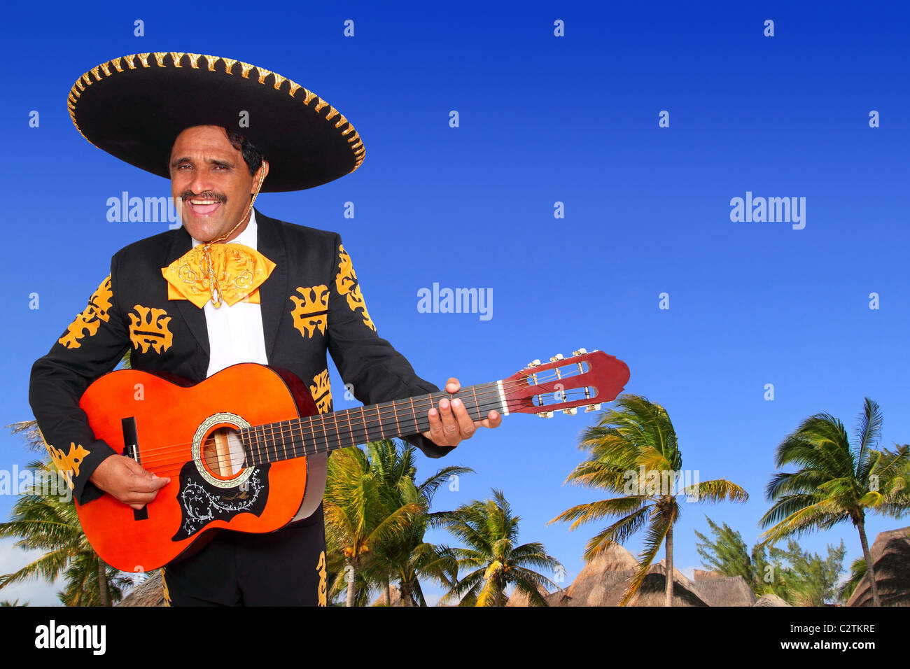 Charro mexican Mariachi playing guitar in tropical Mexico beach Stock ...