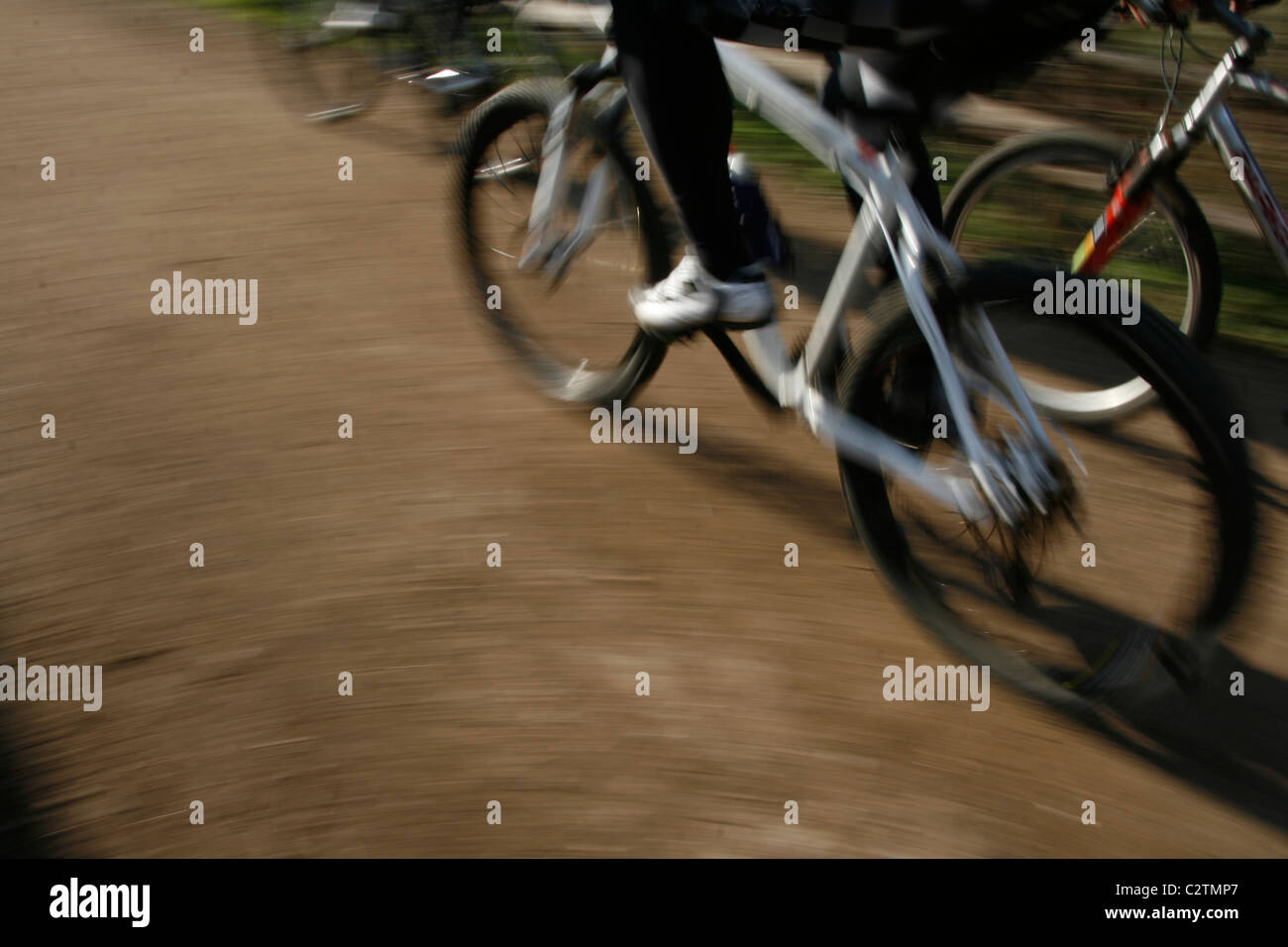 person riding fast bike on rural country path lane Stock Photo - Alamy