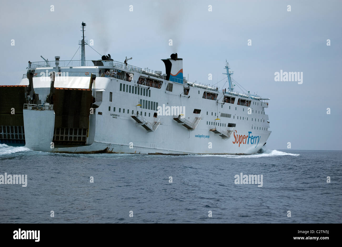 Philippine Super Ferry transports passengers across the seas off Puerto ...