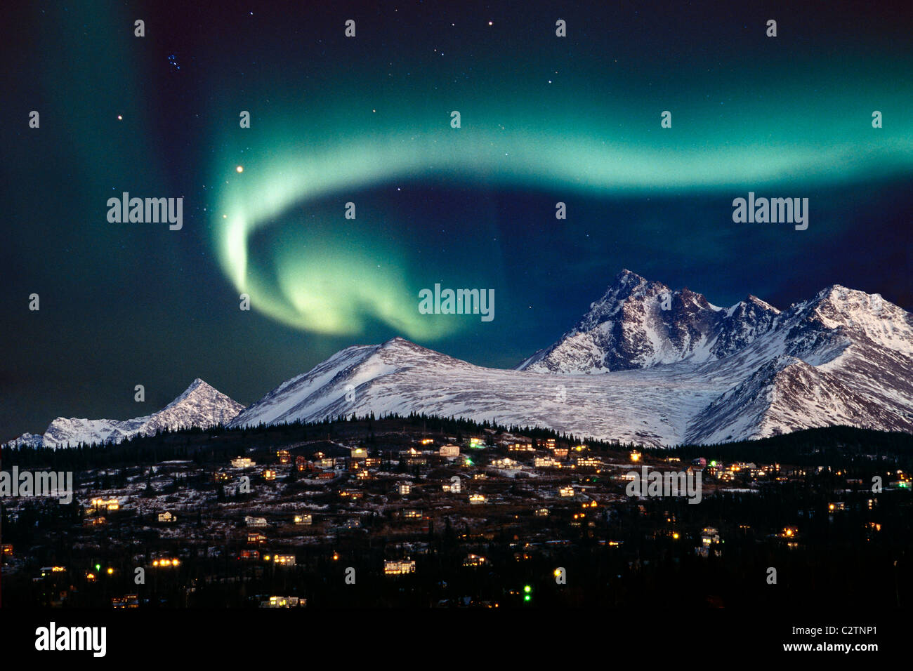 Aurora Borealis over hillside neighborhood & Chugach Mountains ...